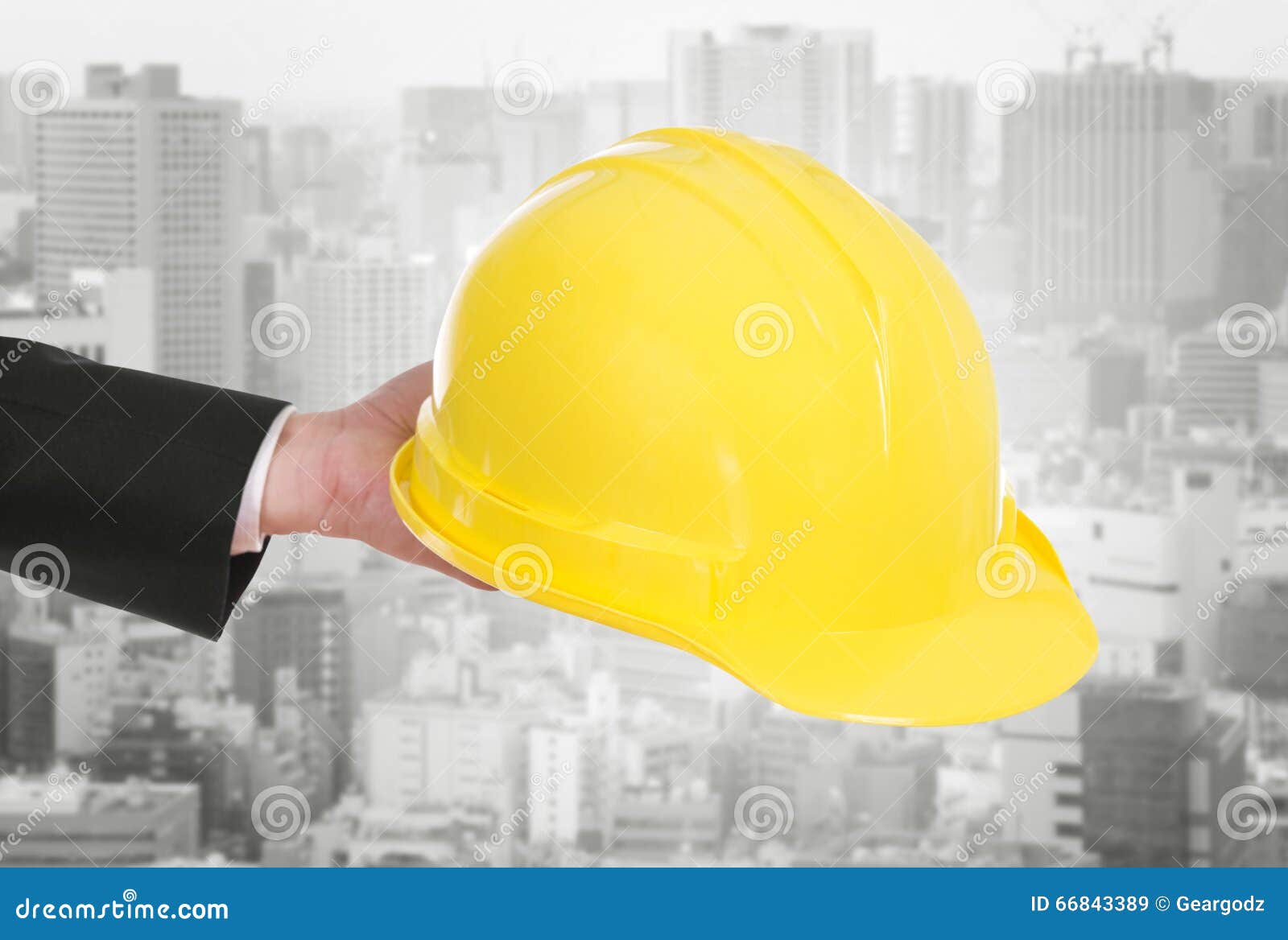 Hand of Engineer Holding Helmet with City Background Stock Image ...