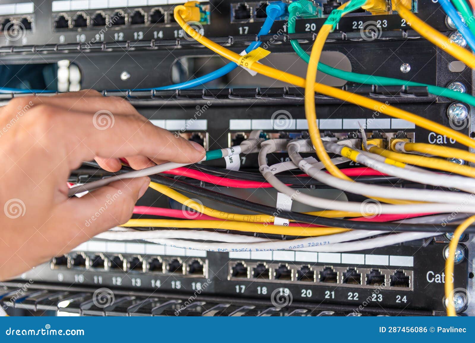 Hand of Engineer Plugging in Ethernet Cable into Server Switch P Stock ...