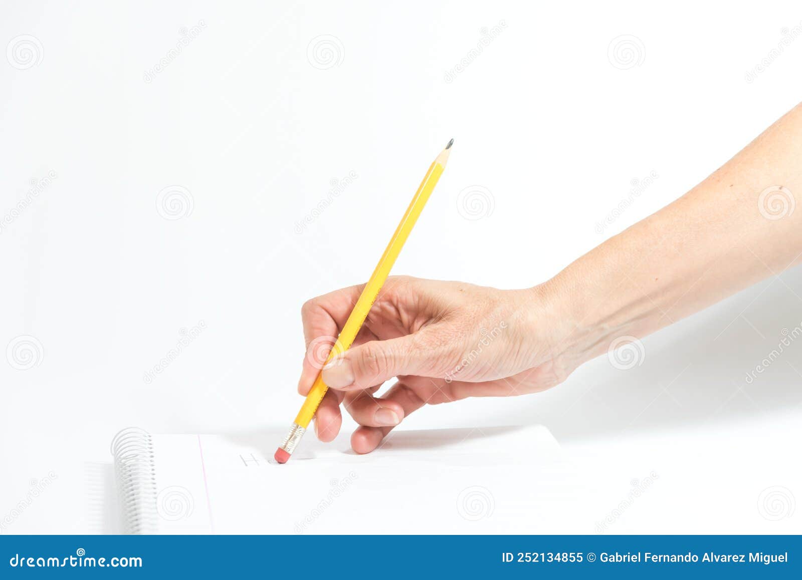 Hand Erasing with the Rubber of a Pencil a Sheet of a Notebook Stock ...