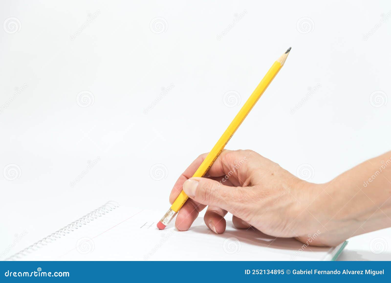 Hand Erasing with the Rubber of a Pencil a Sheet of a Notebook Stock ...