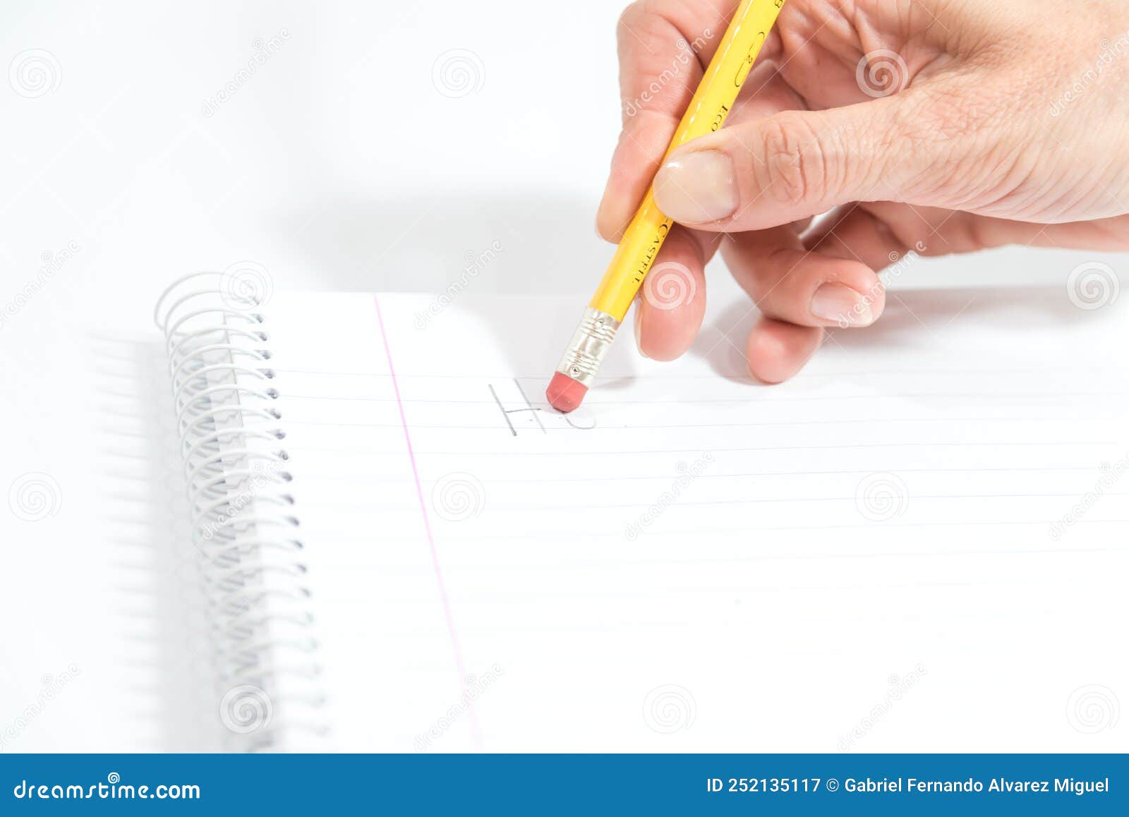 Hand Erasing with the Rubber of a Pencil a Sheet of a Notebook Stock ...