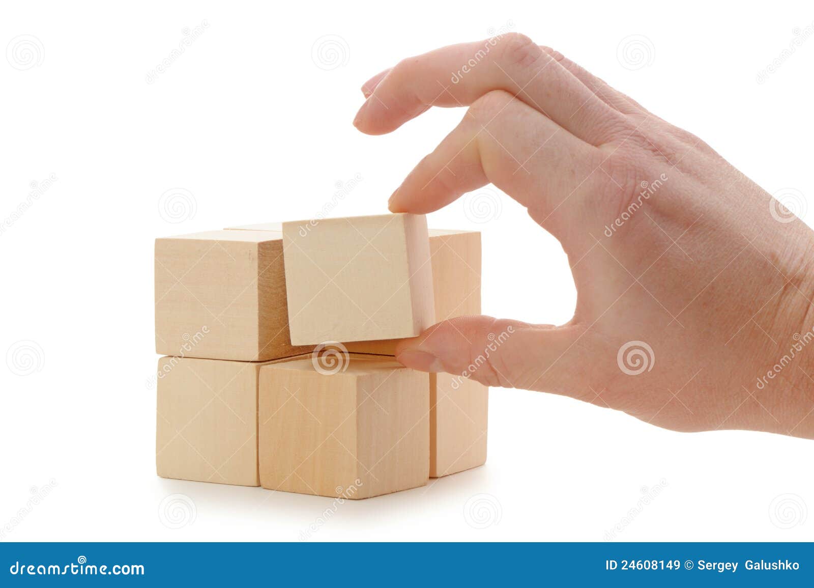 The Hand Establishes a Wooden Cube Stock Image - Image of hand, group ...