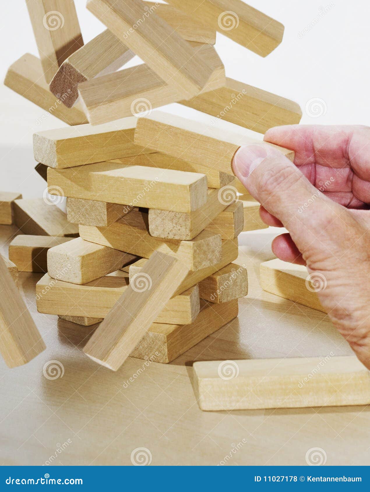 Hand with Falling Building Blocks Stock Photo - Image of effect ...
