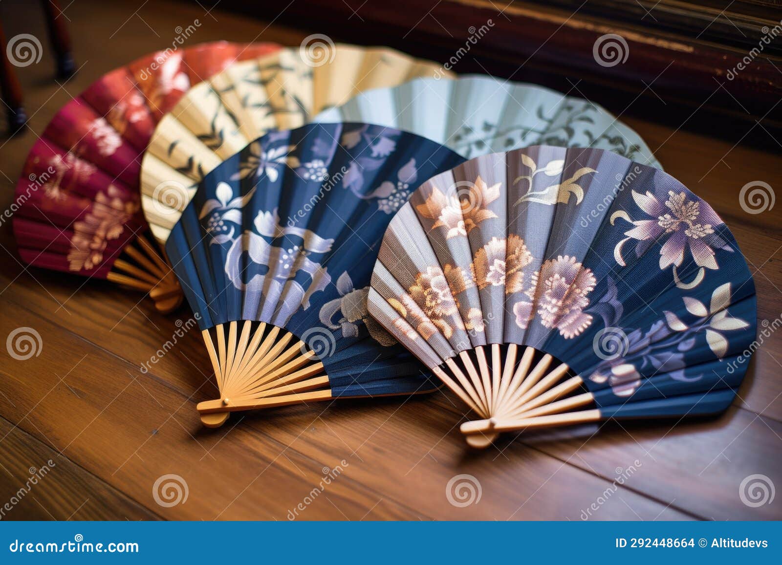 Hand Fans with Floral Designs Spread Open on a Bamboo Mat Stock Photo ...