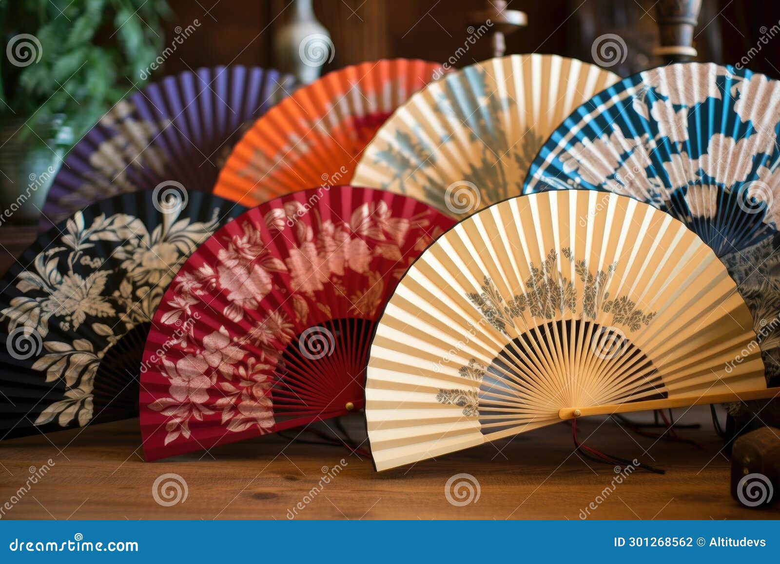 Hand Fans with Floral Designs Spread Open on a Bamboo Mat Stock Photo ...