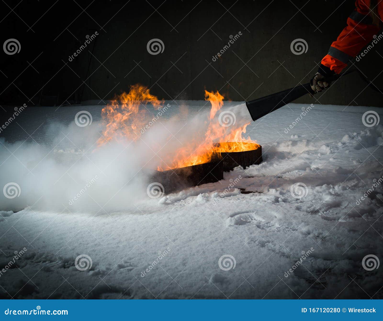 Hand of a Firefighter Putting Out the Fire on the Snow Stock Photo ...
