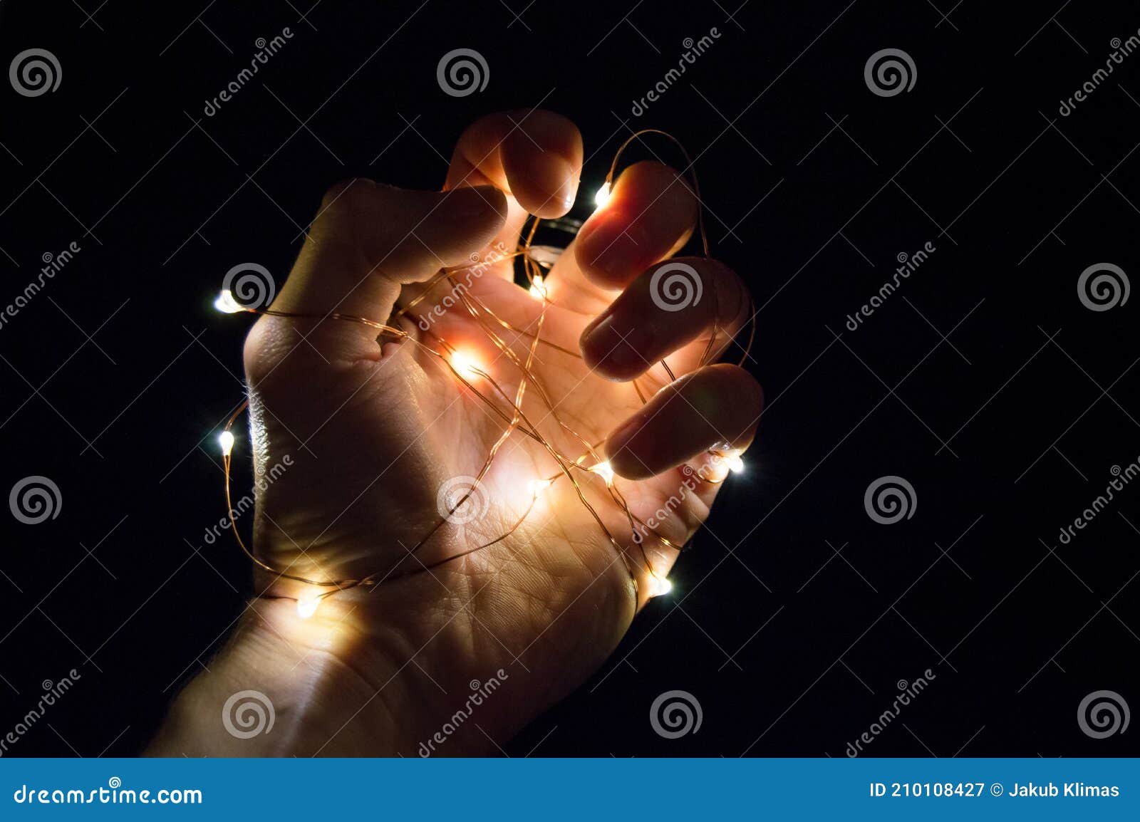 Hand in Fist Tangled Up in a Glowing Copper Wire Stock Image - Image of ...