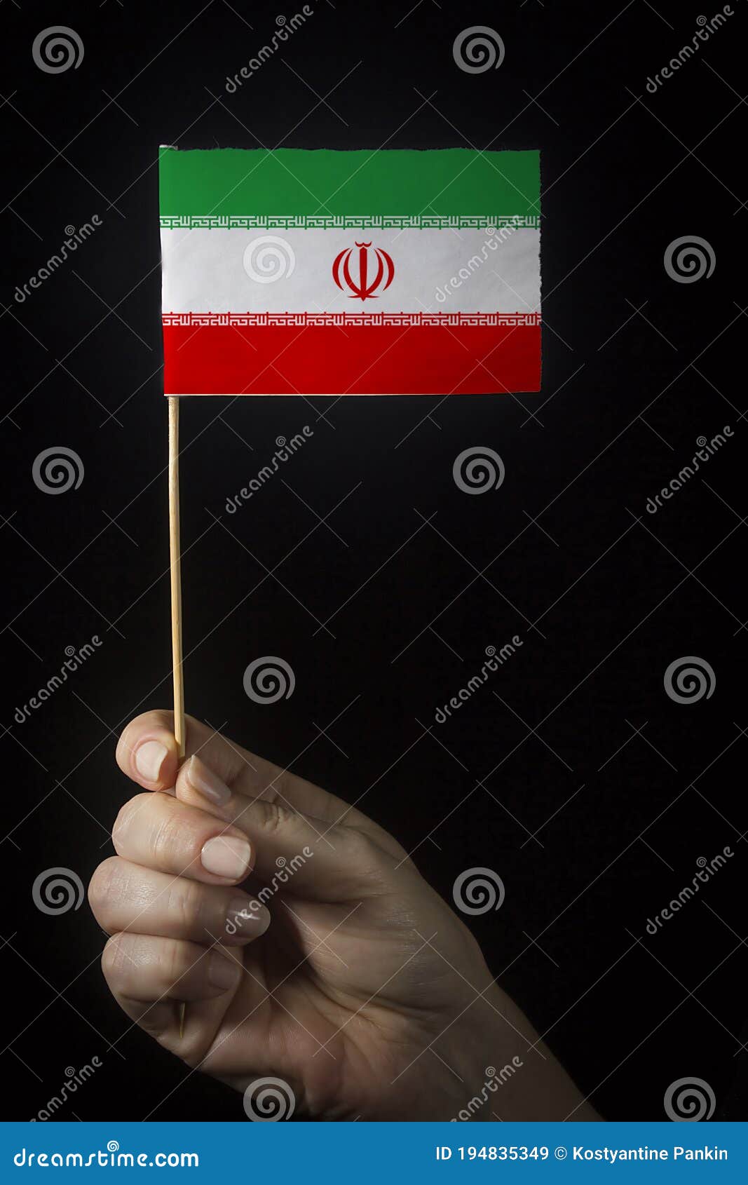 Hand with flag of Iran stock image. Image of emblem - 194835349
