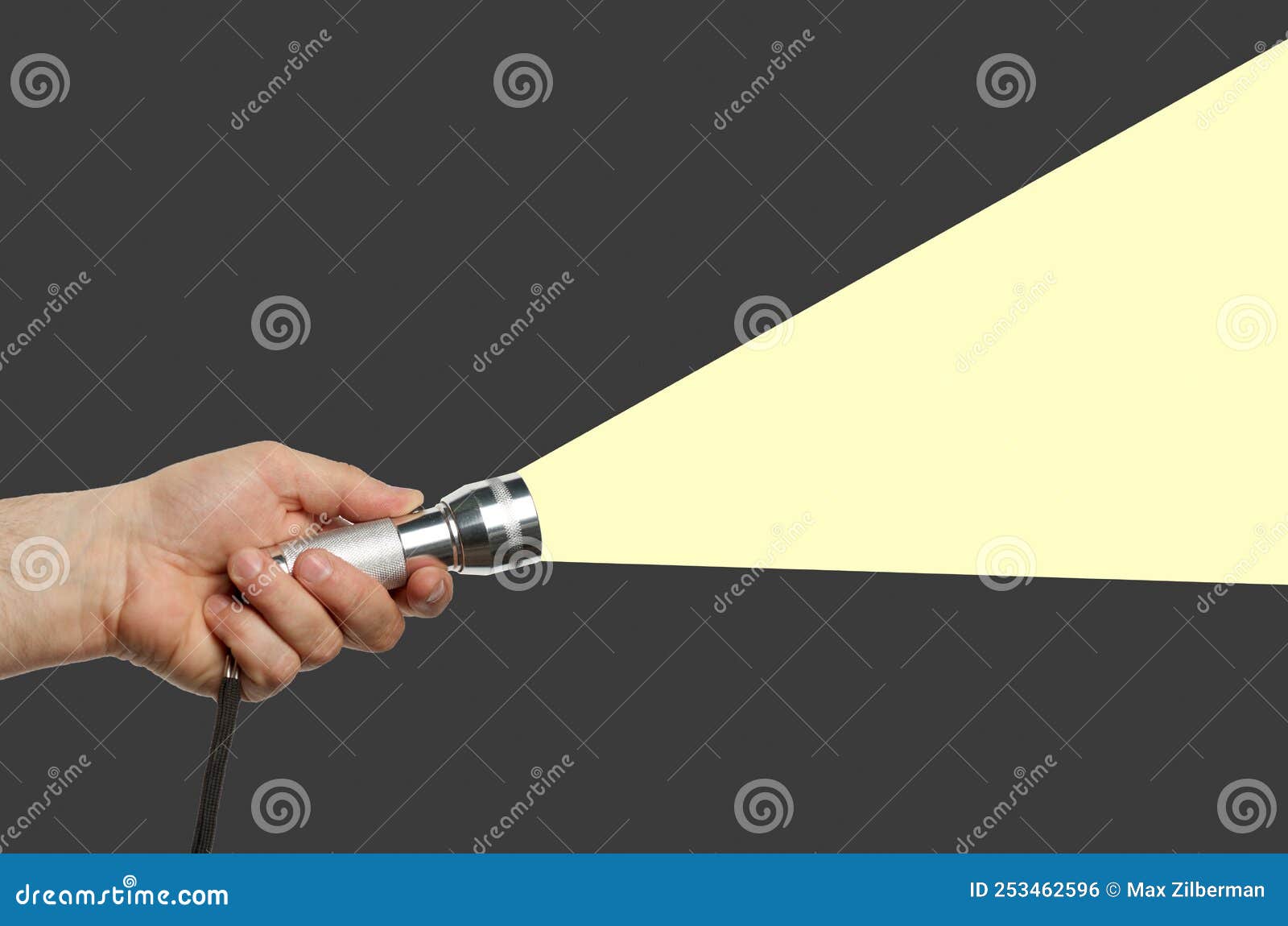Hand with a Flashlight Over Dark Background with Painted Cone of Yellow ...