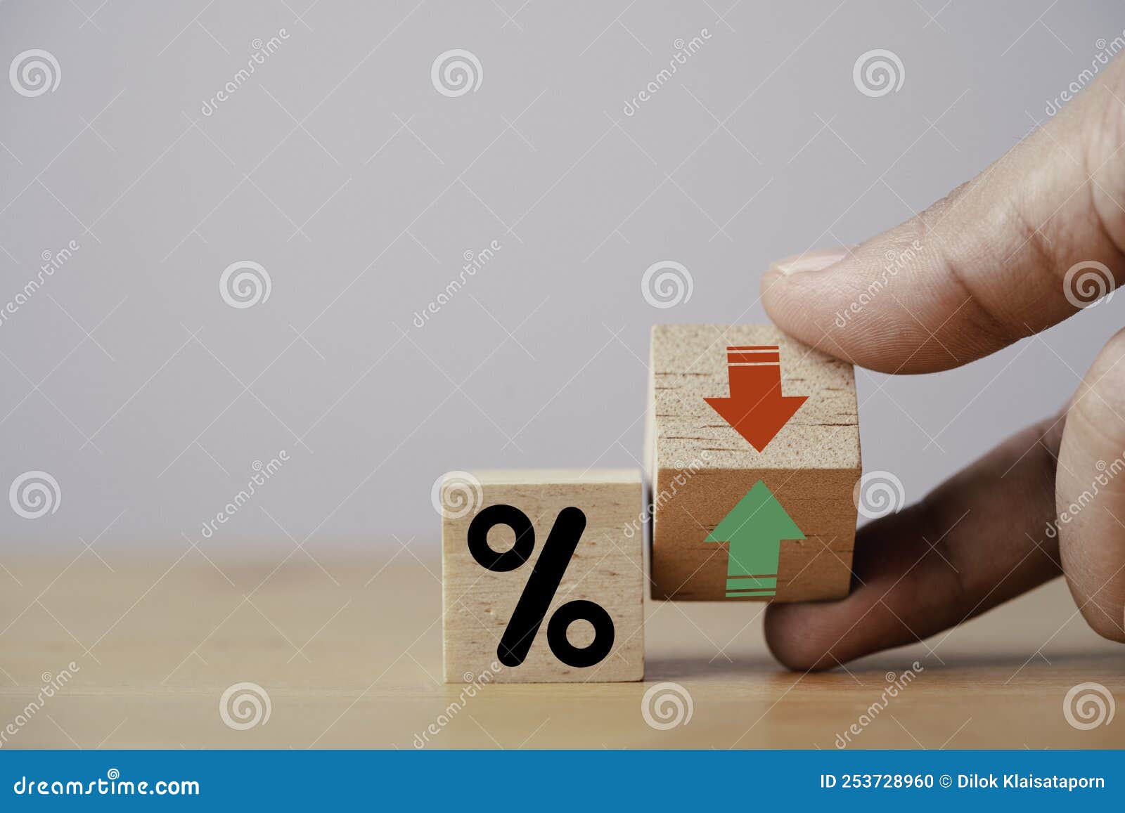 Hand Flipping Wooden Cube Block To Change between Up and Down with Percentage Sign Symbol for ...