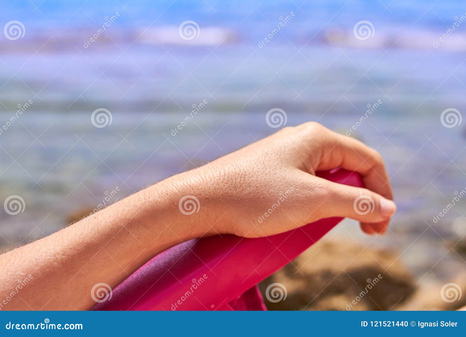 Hand in front of the beach stock photo. Image of girl - 121521440