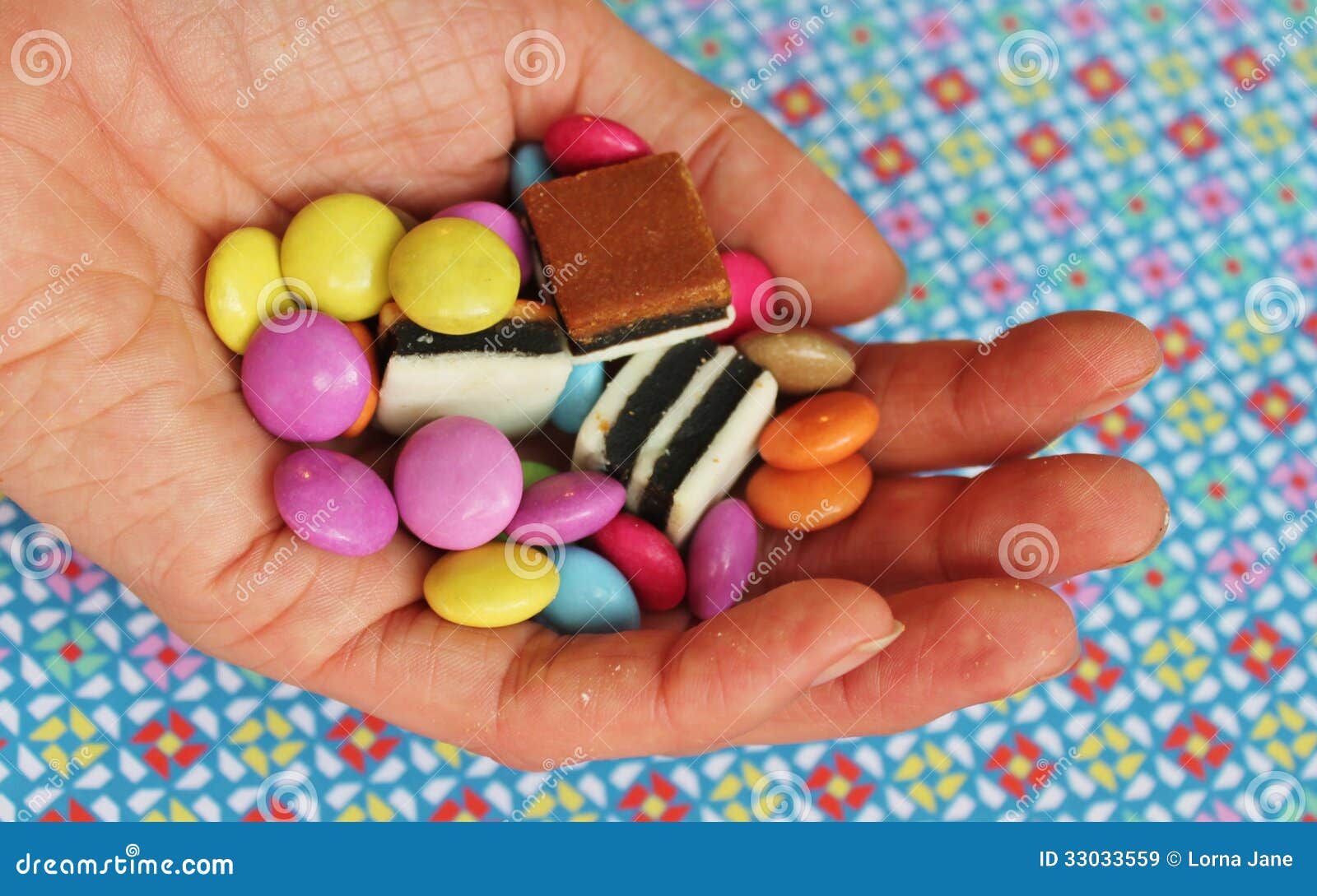 Hand full of sweets stock image. Image of coconut, pink - 33033559