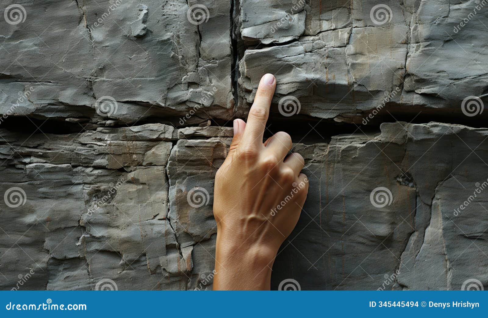 Hand Pointing at Something on Rock Wall Stock Photo - Image of explore ...