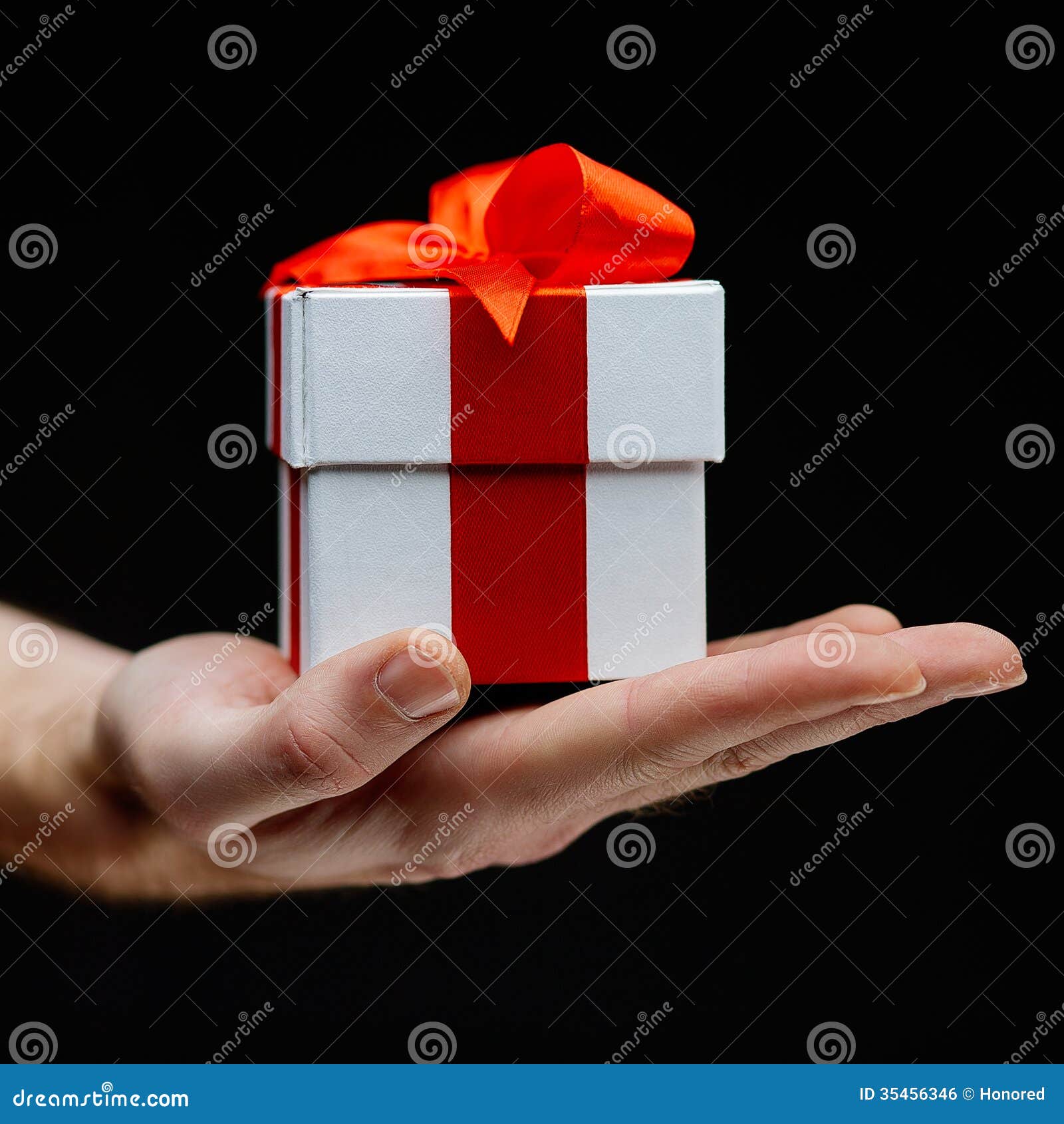 Hand with giftbox stock photo. Image of isolated, design - 35456346