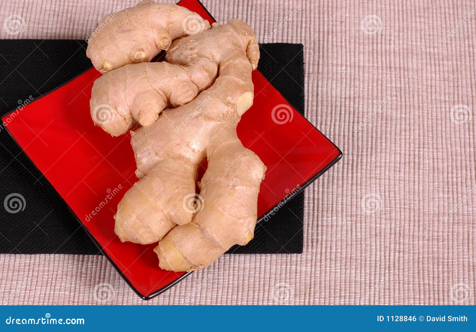 Hand of Ginger on Red Plate and Black Napkin Stock Photo - Image of ...