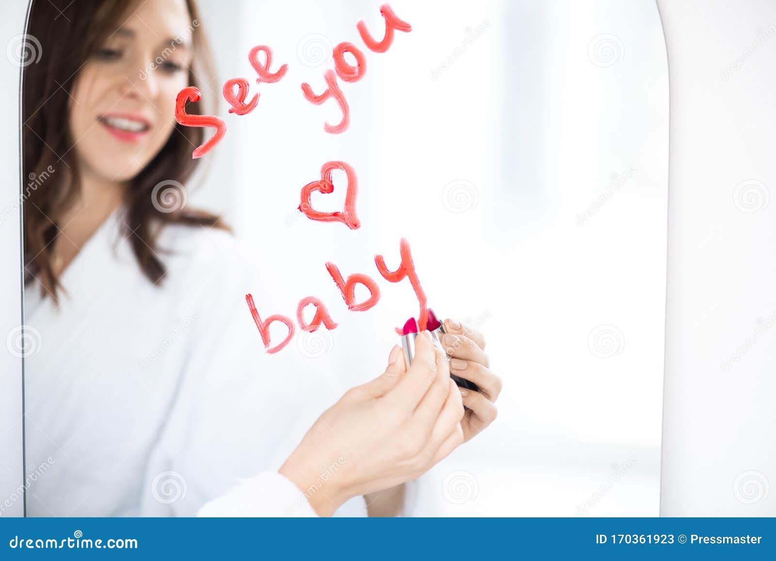 Hand Of Girl In Bathrobe Writing Love Message And Drawing Heart With