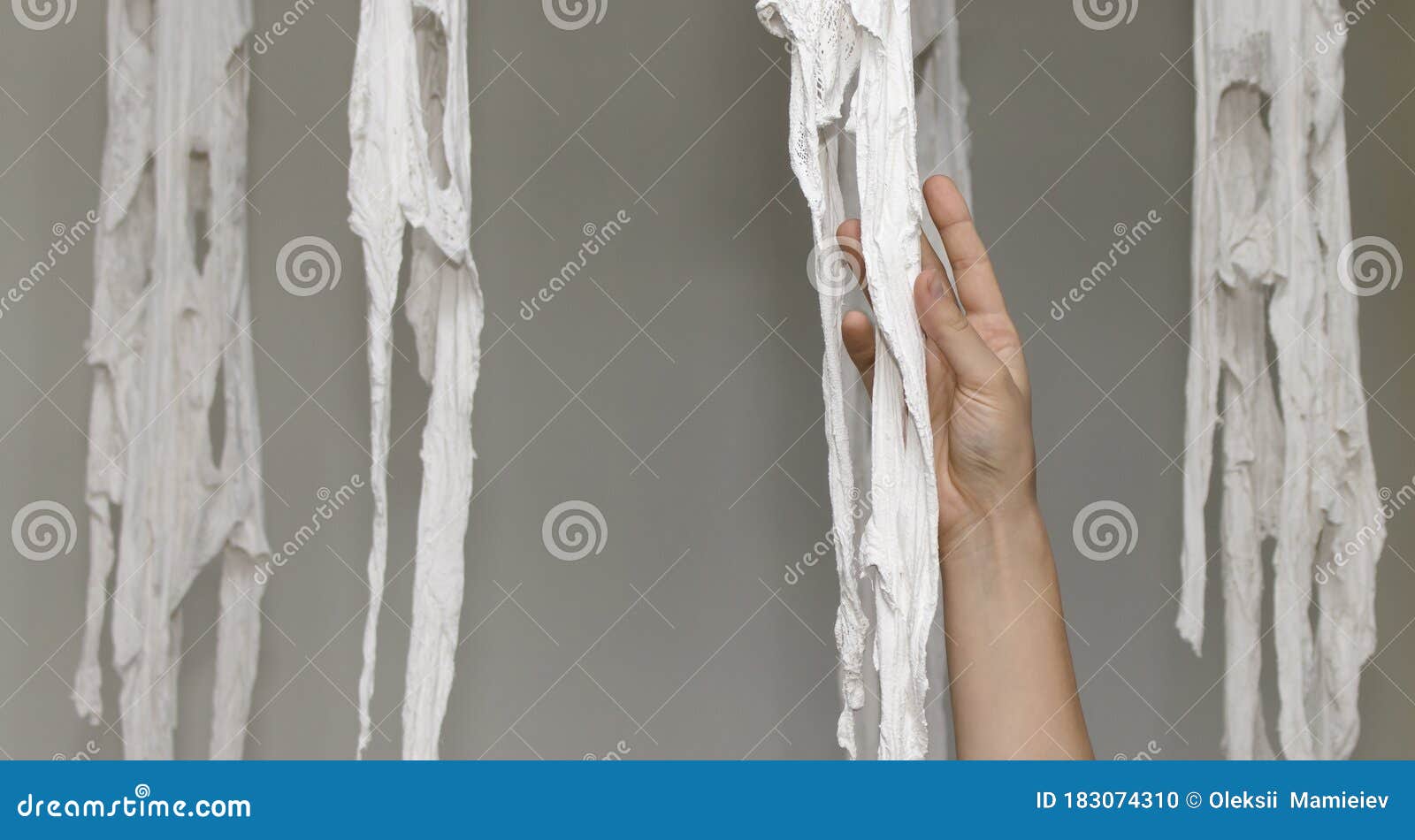 The Hand of the Girl Pulls Her Fingers To the Cloth Covered with ...