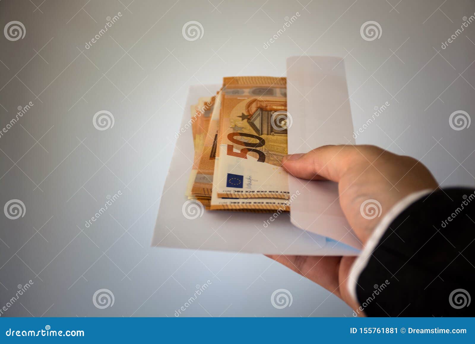 A Hand Giving an Envelope Full of Money, 50 Euro Notes Stock Image ...