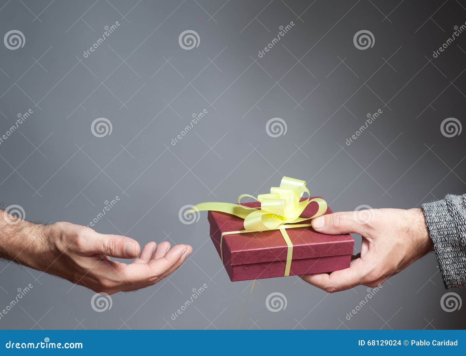 Hand giving a gift stock photo. Image of concept, give - 68129024