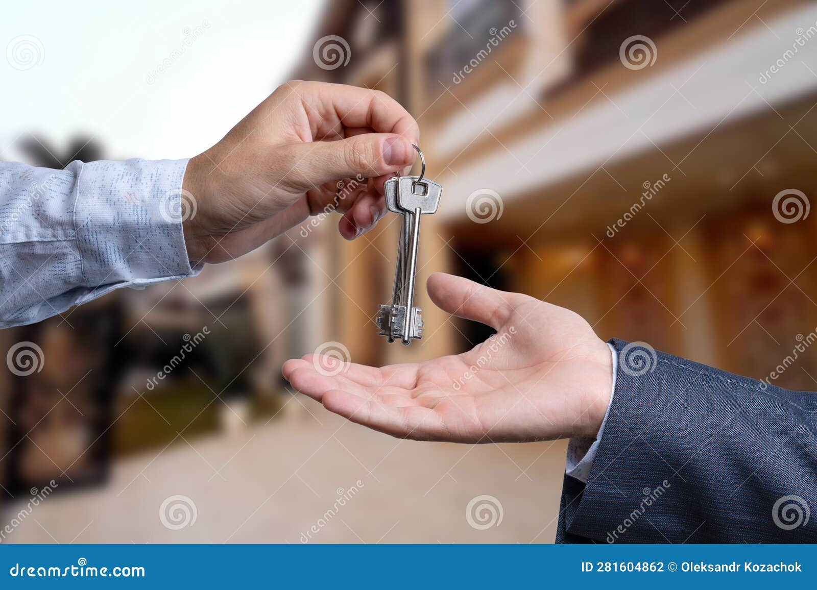 A Hand Giving a Key To Another Hand. House in the Background. Stock ...