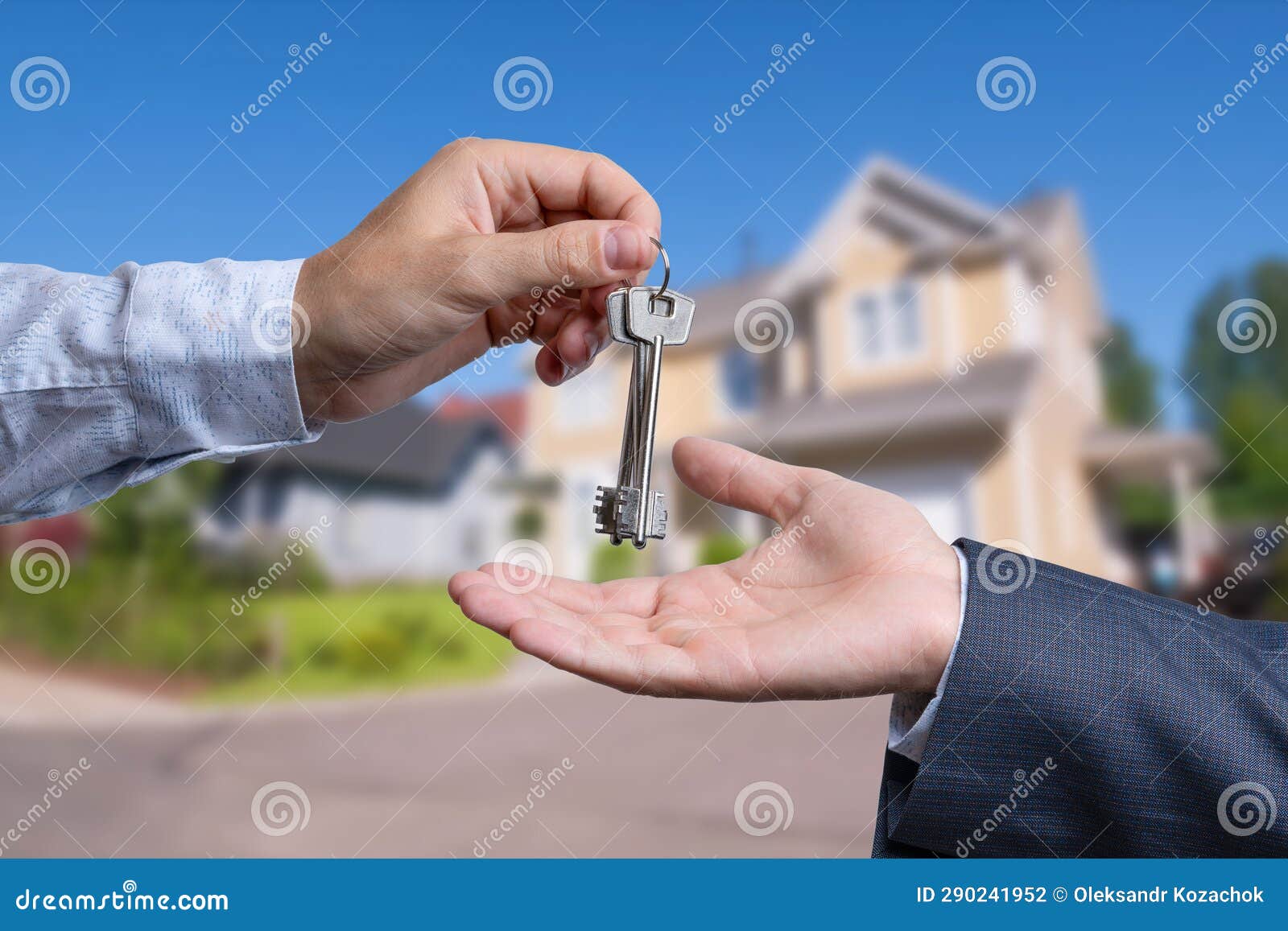 A Hand Giving a Key To Another Hand. House in the Background. Stock ...