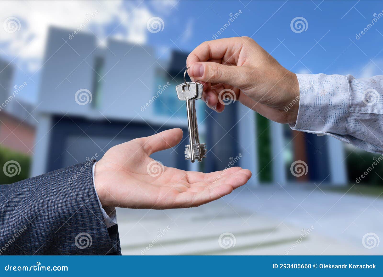 A Hand Giving a Key To Another Hand. House in the Background. Stock ...