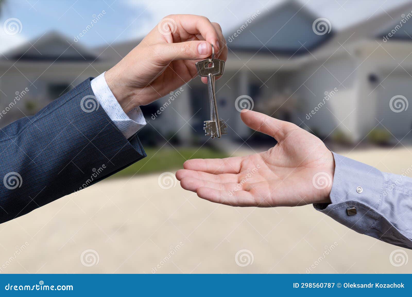 A Hand Giving a Key To Another Hand. House in the Background. Stock ...