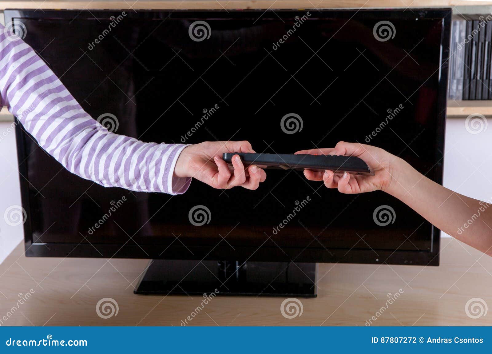 Hand Giving the Remote Control To Another Hand Stock Photo - Image of ...
