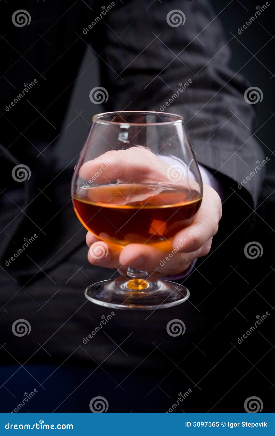 Hand with glass of cognac stock image. Image of necktie - 5097565
