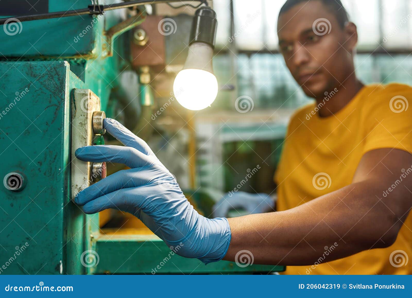 Hand in Glove Pushing Button on Compressing Machine Stock Image - Image ...
