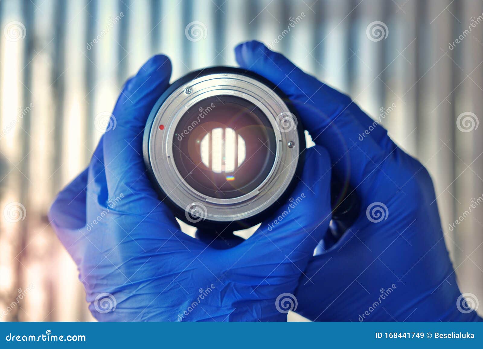 Hand with Glow Holding and Checking Camera Lens Stock Image - Image of ...