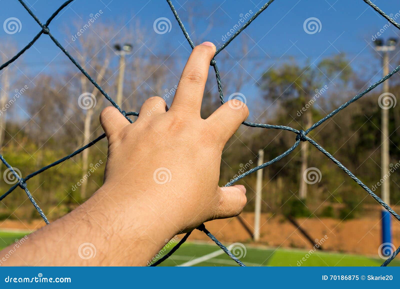 Hand grab the rope mesh stock image. Image of safety - 70186875