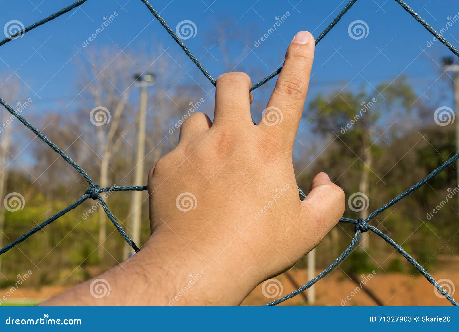 Hand grab the rope mesh stock image. Image of border - 71327903