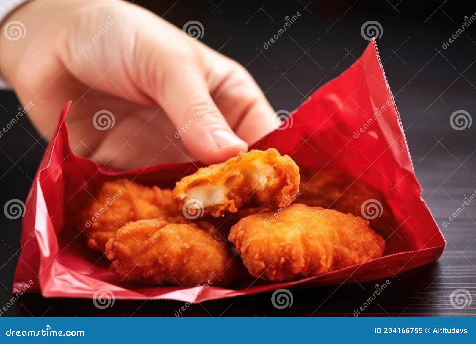 Hand Grabbing a Chicken Nugget from a Drive-through Bag Stock Image ...