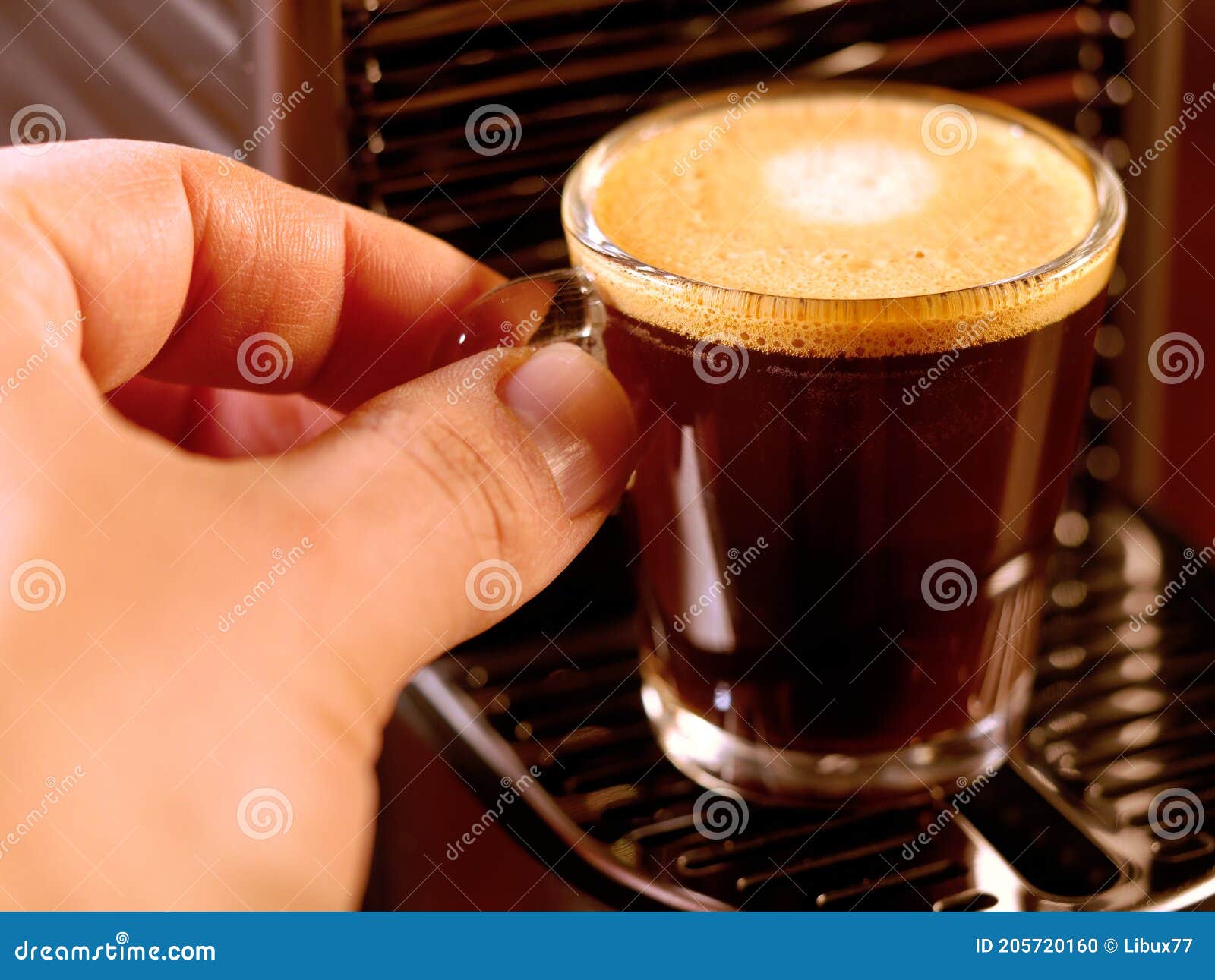 Hand Grabbing Glass of Coffee Espresso Machine Closeup Stock Photo ...