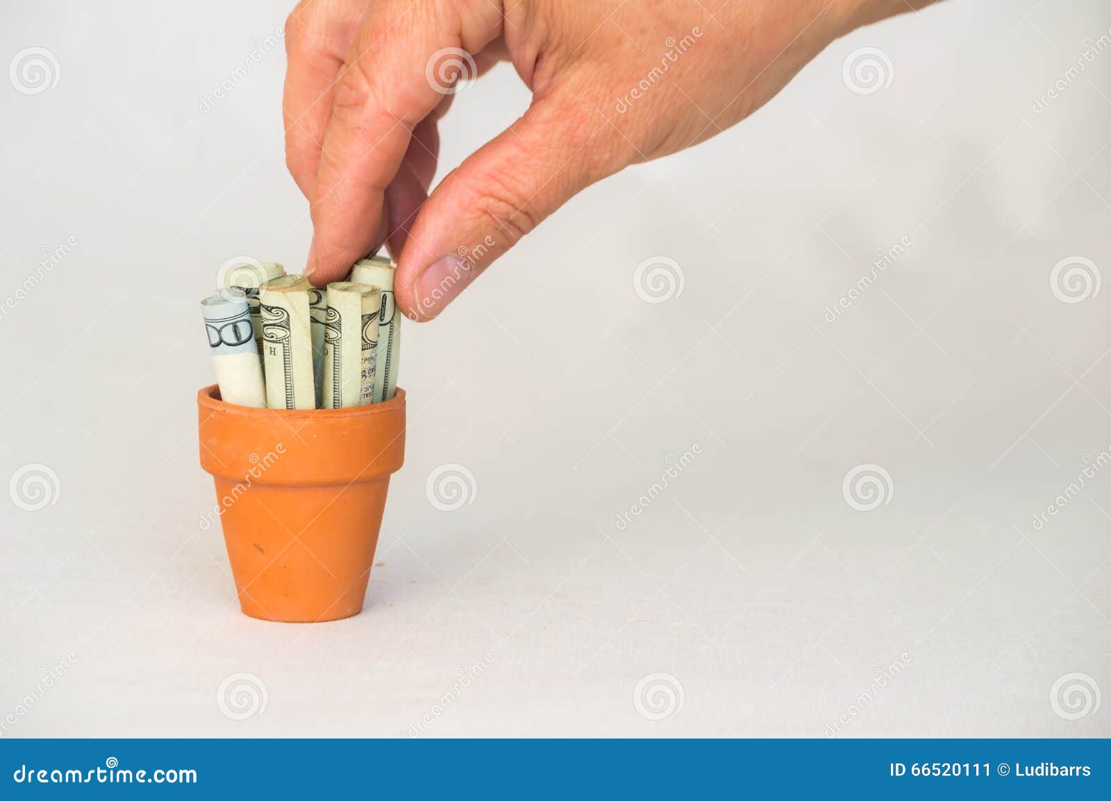 Hand Grabbing Money in a Terracotta Pot Stock Image - Image of money ...