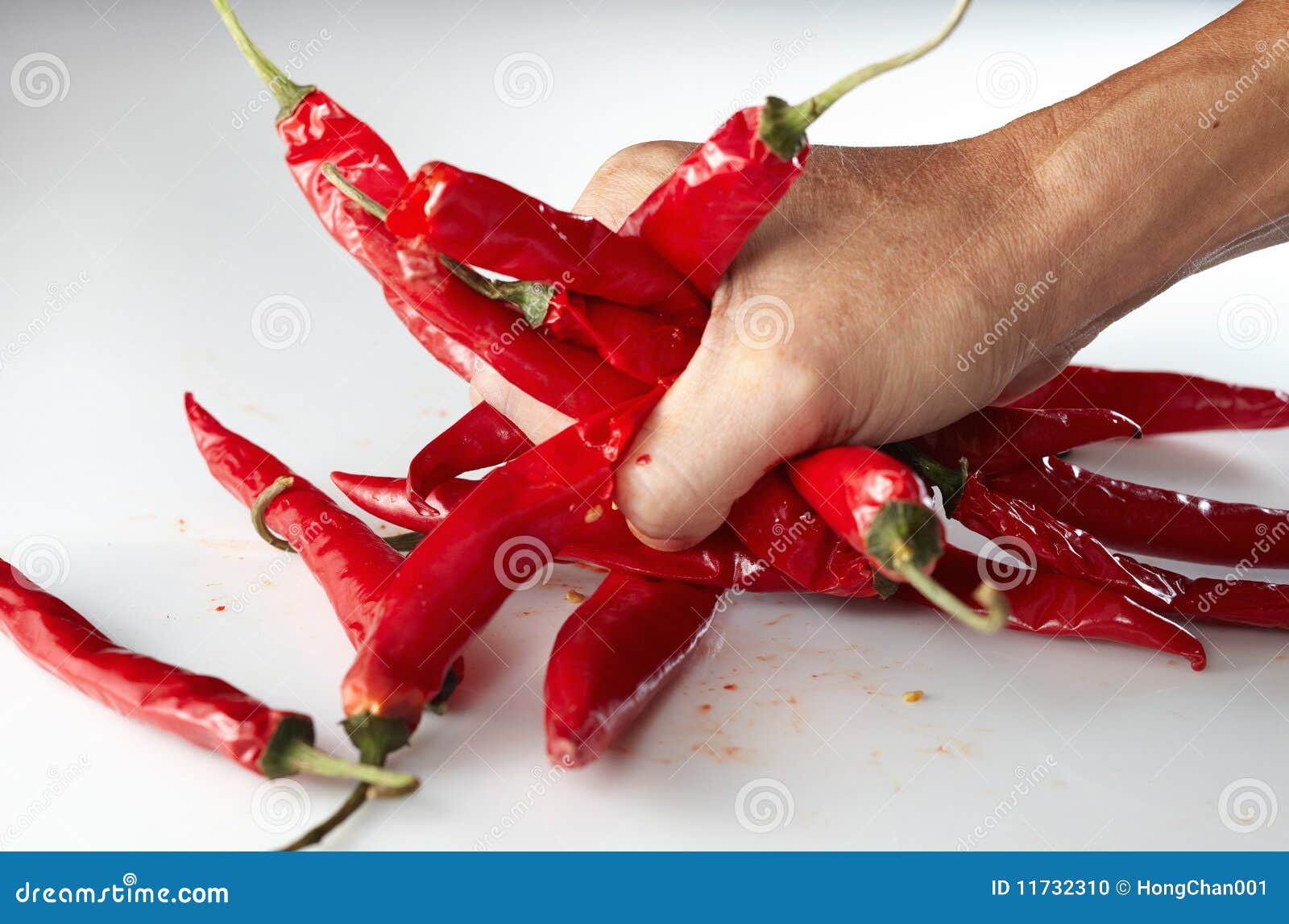 Hand grabing chili stock photo. Image of hold, chili - 11732310