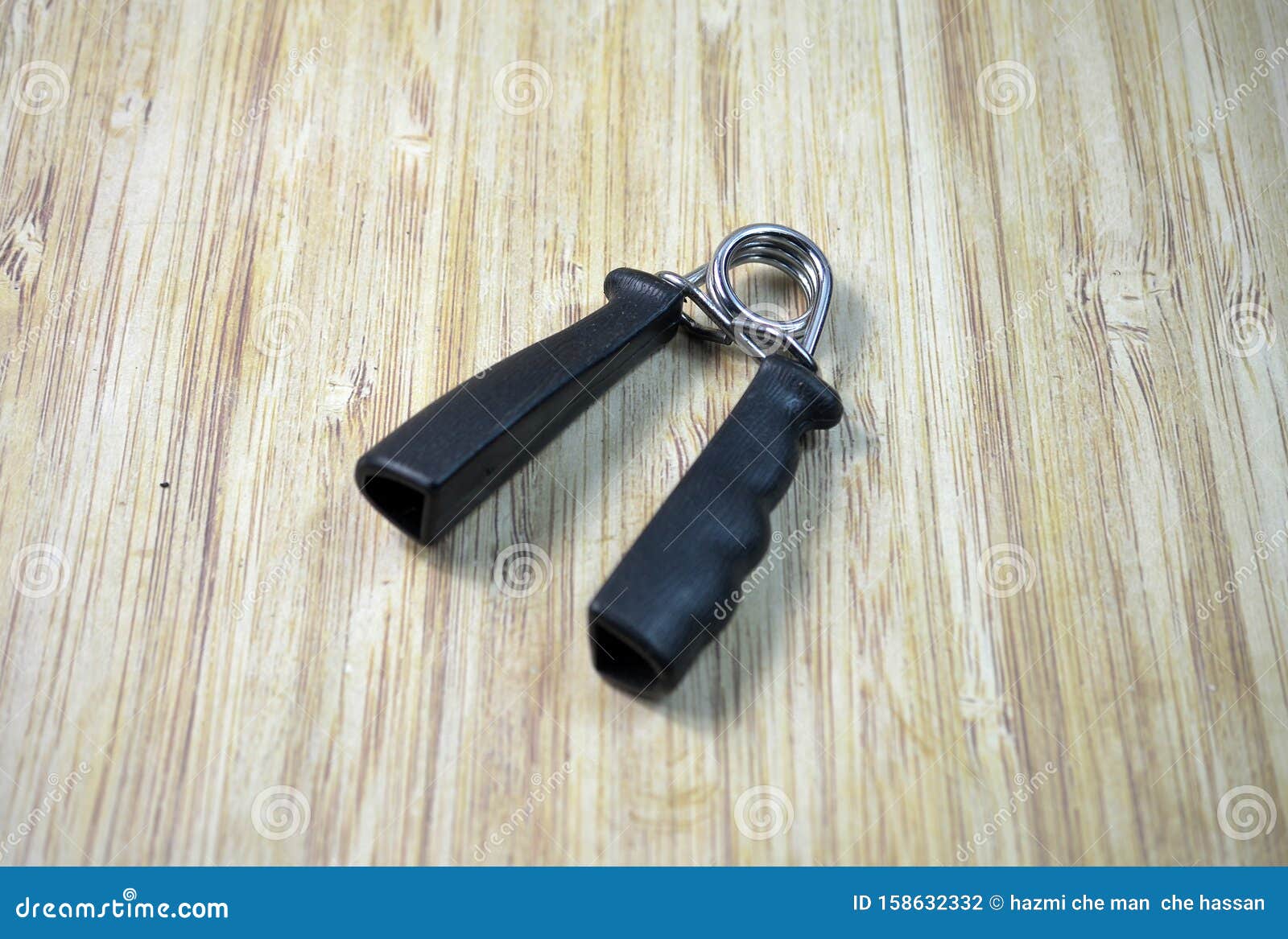 Hand Grip Tool on Wooden Table Background Stock Photo - Image of grip ...