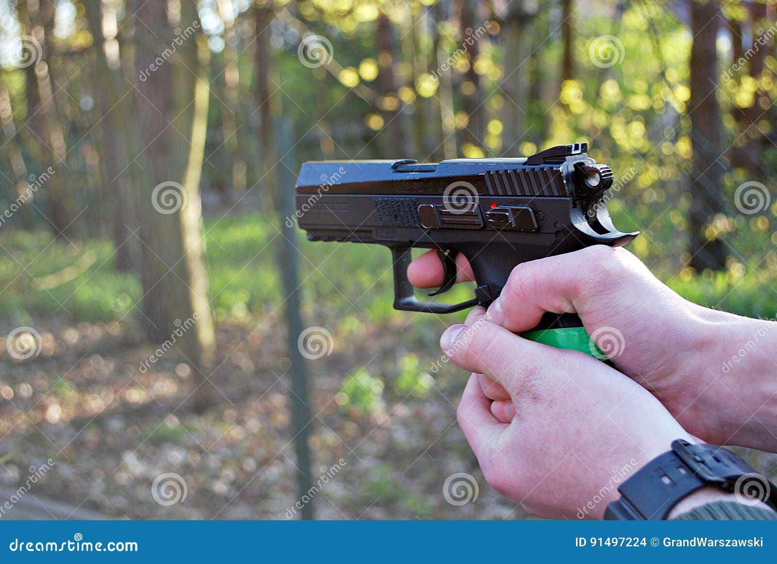 Hand with gun stock photo. Image of confident, pants - 91497224