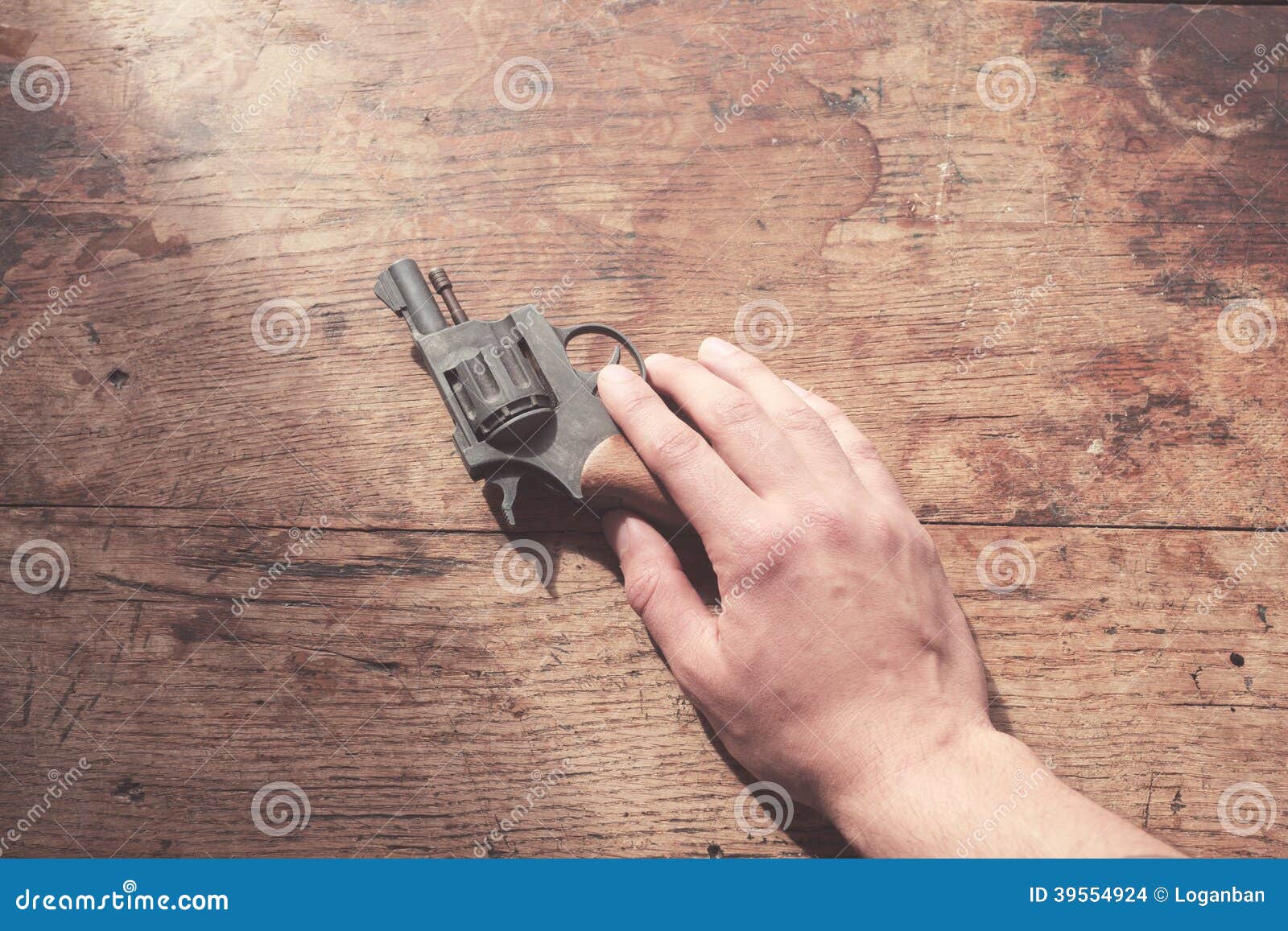 Hand with gun at table stock photo. Image of hand, daylight - 39554924