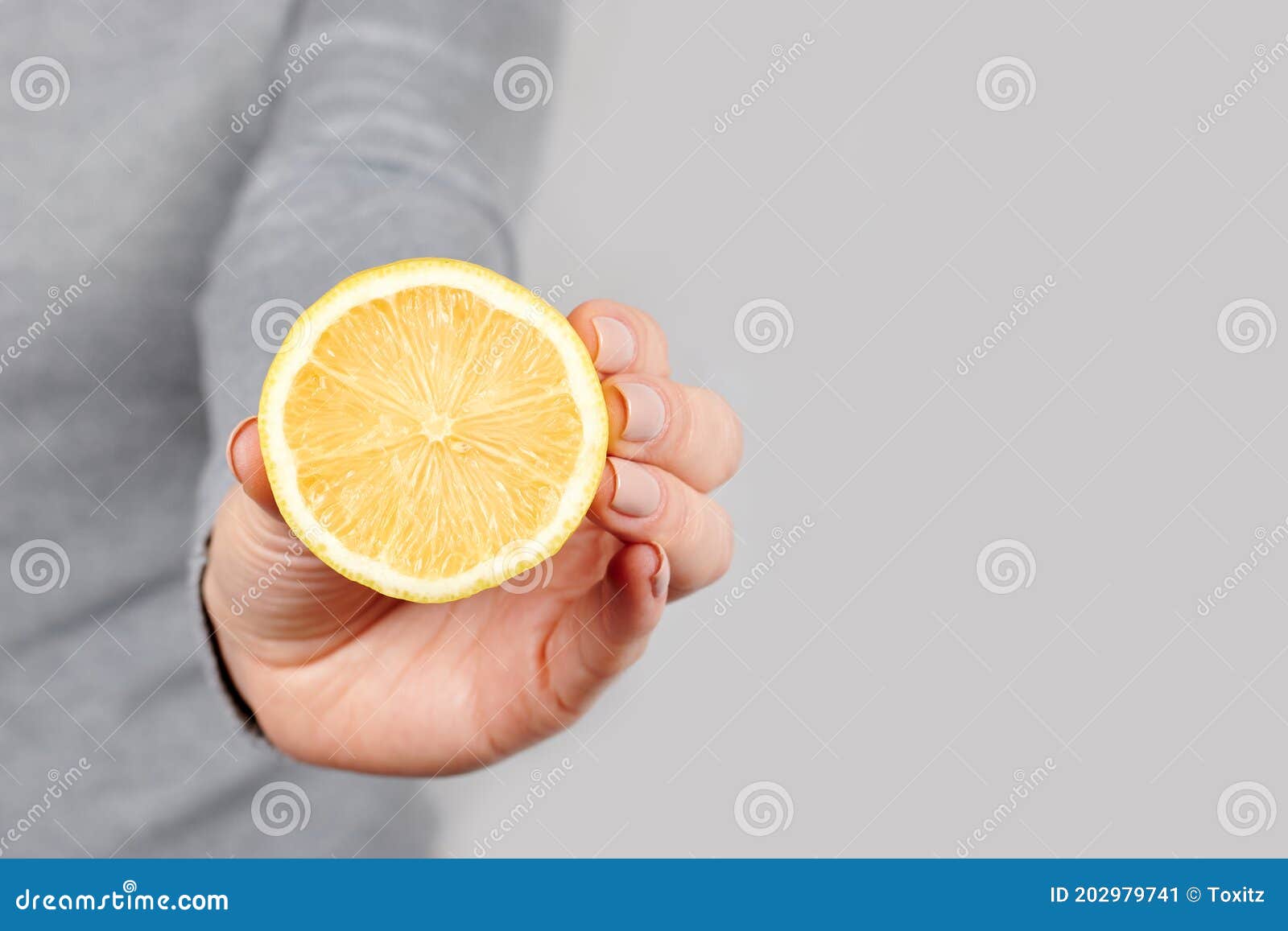Hand with Half Lemon on Grey Background Stock Image - Image of piece ...