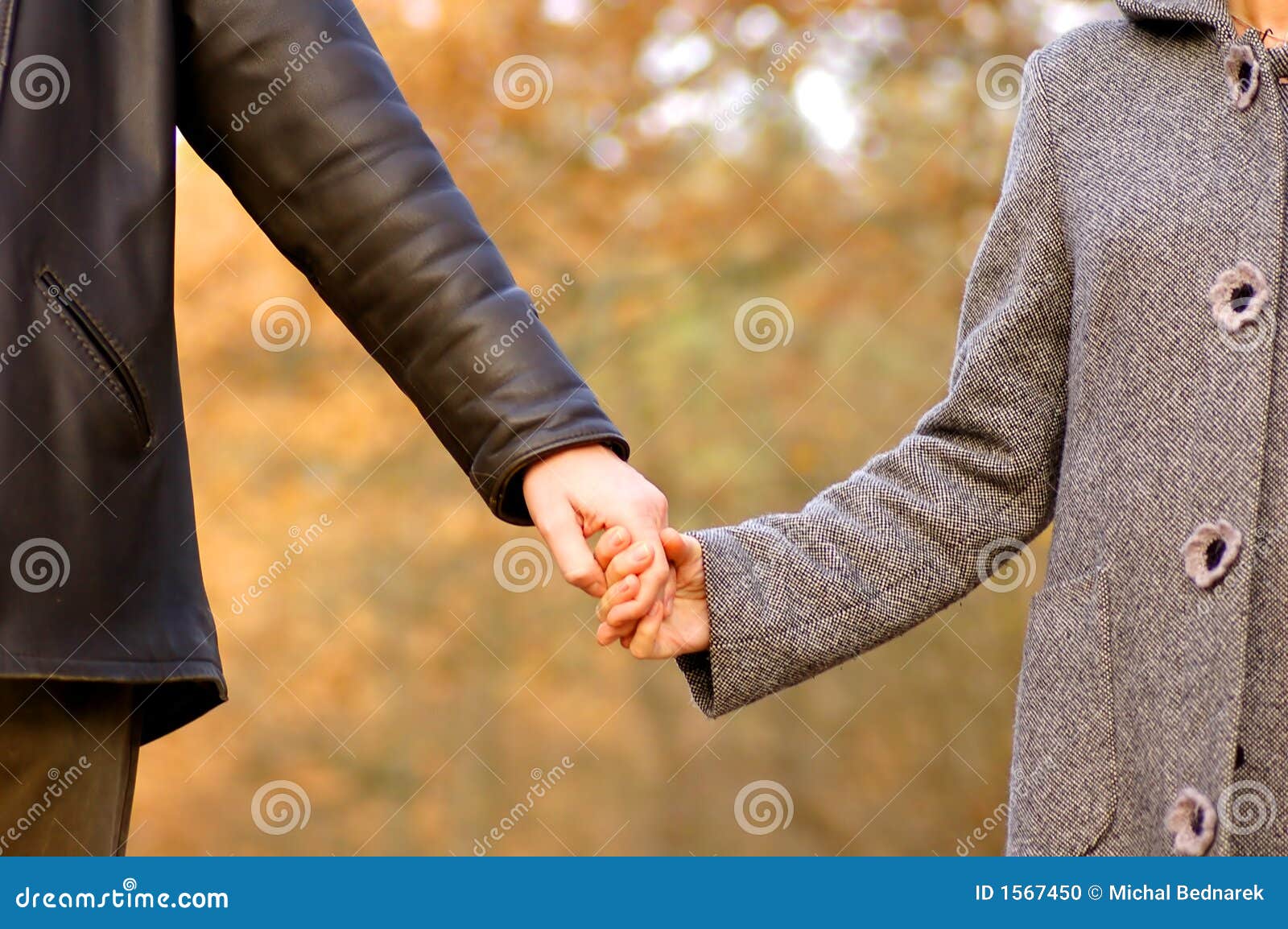 Hand-in-hand stock photo. Image of outdoor, woman, love - 1567450