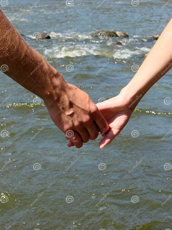 Hand in a hand stock photo. Image of hold, clouds, helping - 2962572