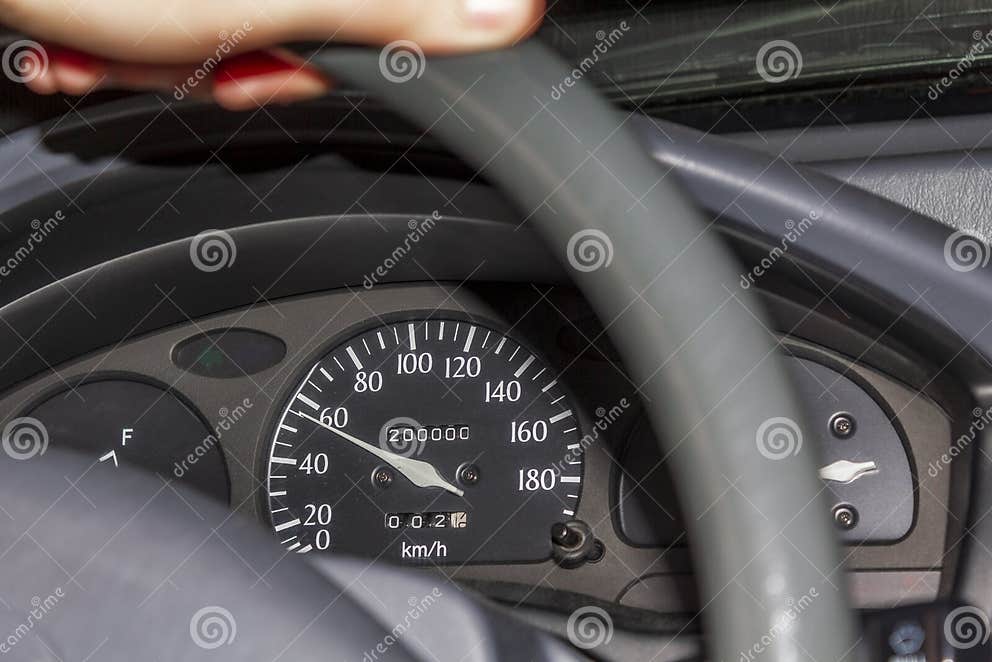 Hand on the Handlebars in the Car. Speedometer Steering Wheel Stock ...