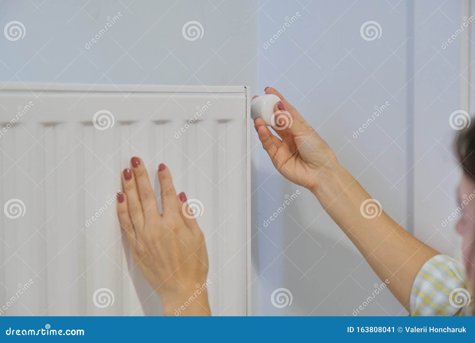 Hand on Heating Radiator Regulates the Temperature with Thermostat ...