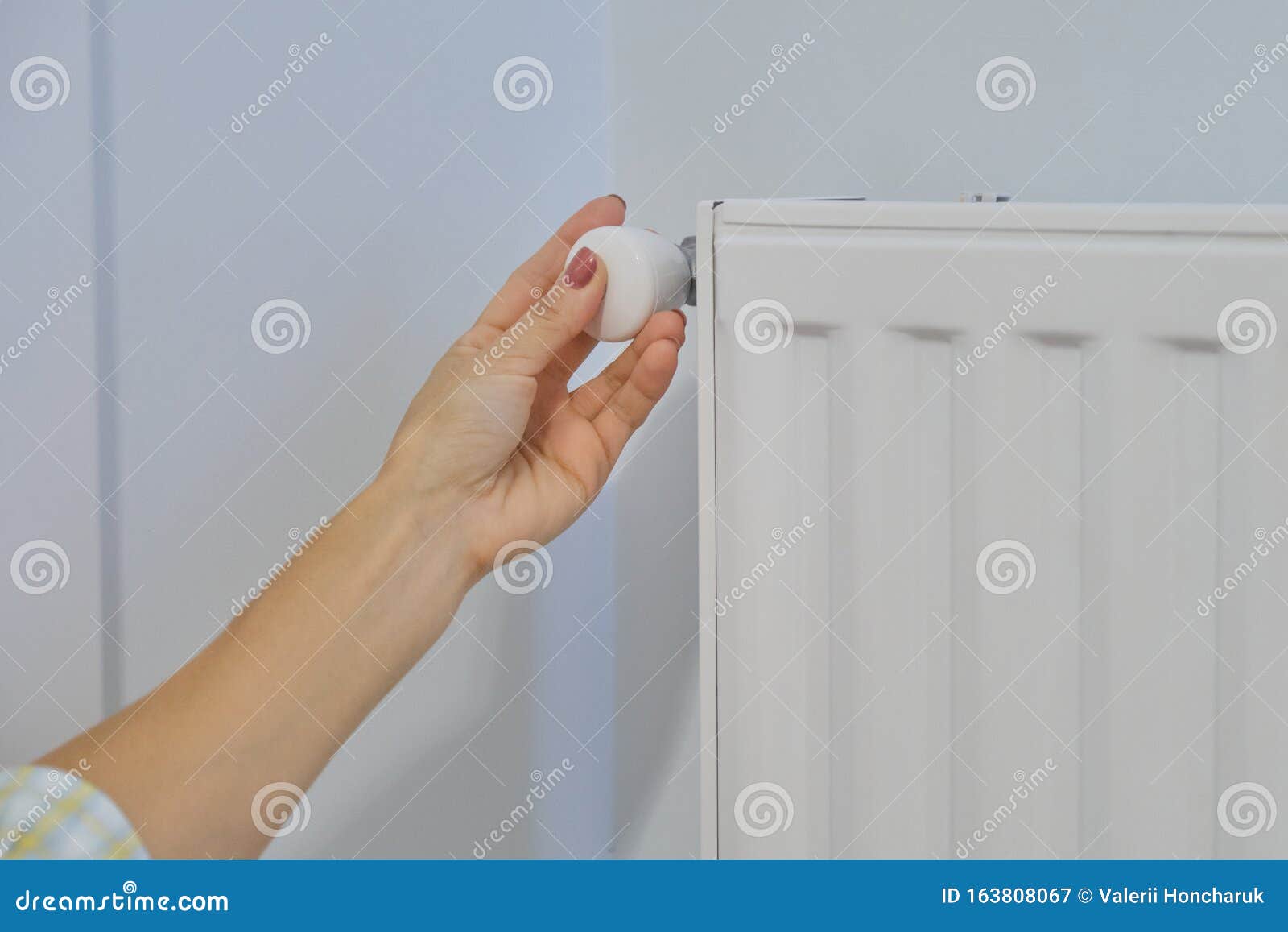 Hand on Heating Radiator Regulates the Temperature with Thermostat ...