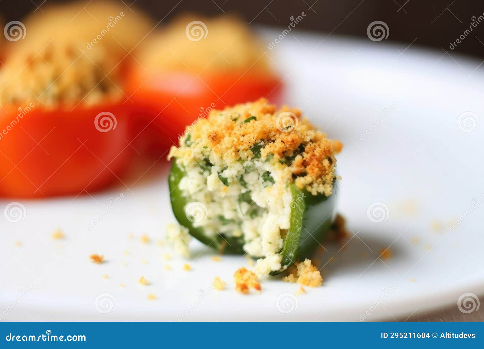 Hand-held Stuffed Bell Pepper, Bite Taken, on White Plate Stock Photo ...