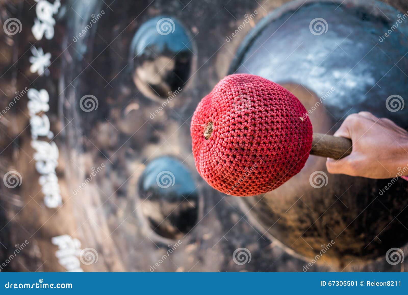 Hand hit big gong. stock image. Image of human, circle - 67305501