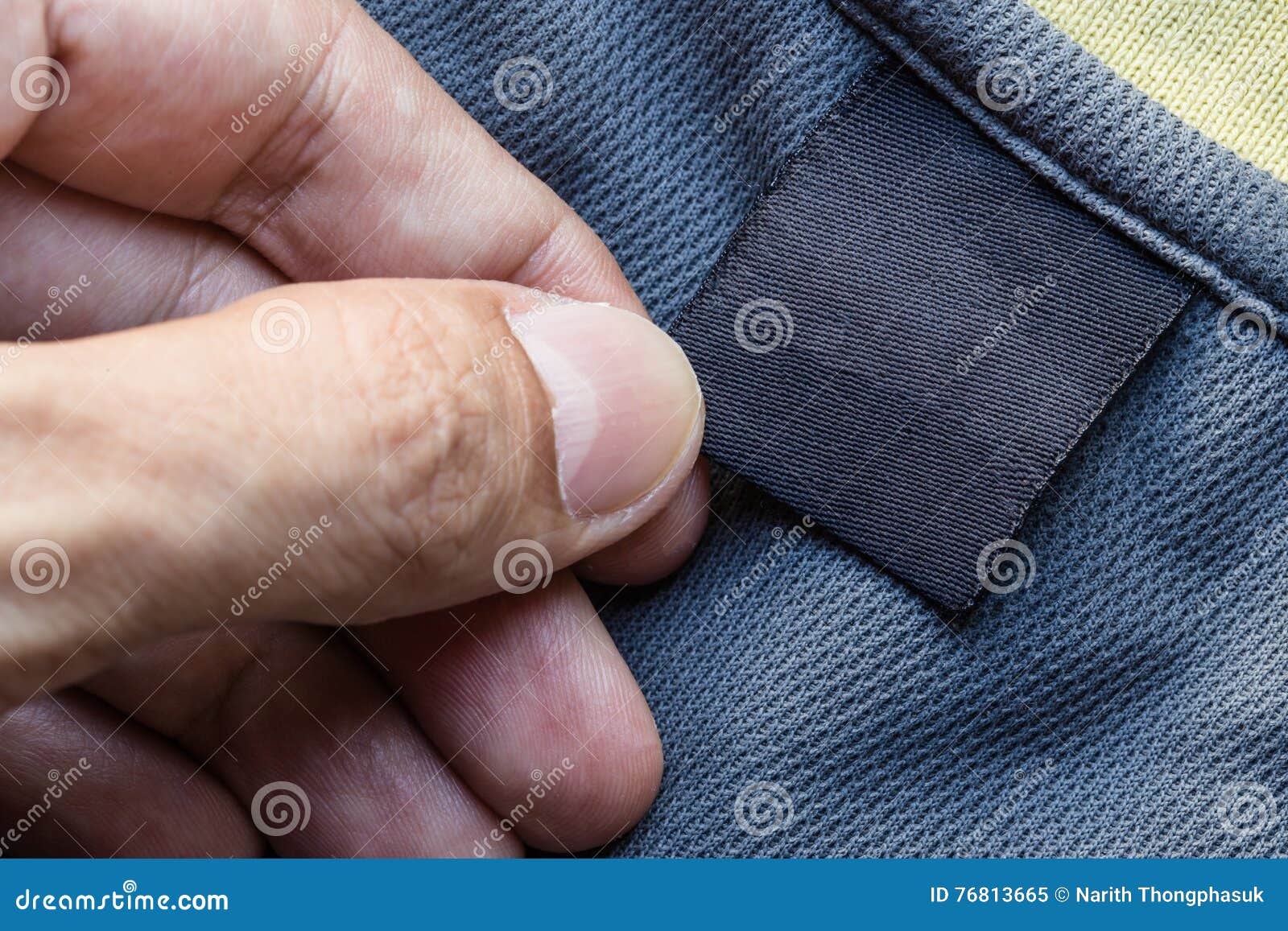 Hand hold clothing label stock image. Image of accessory - 76813665