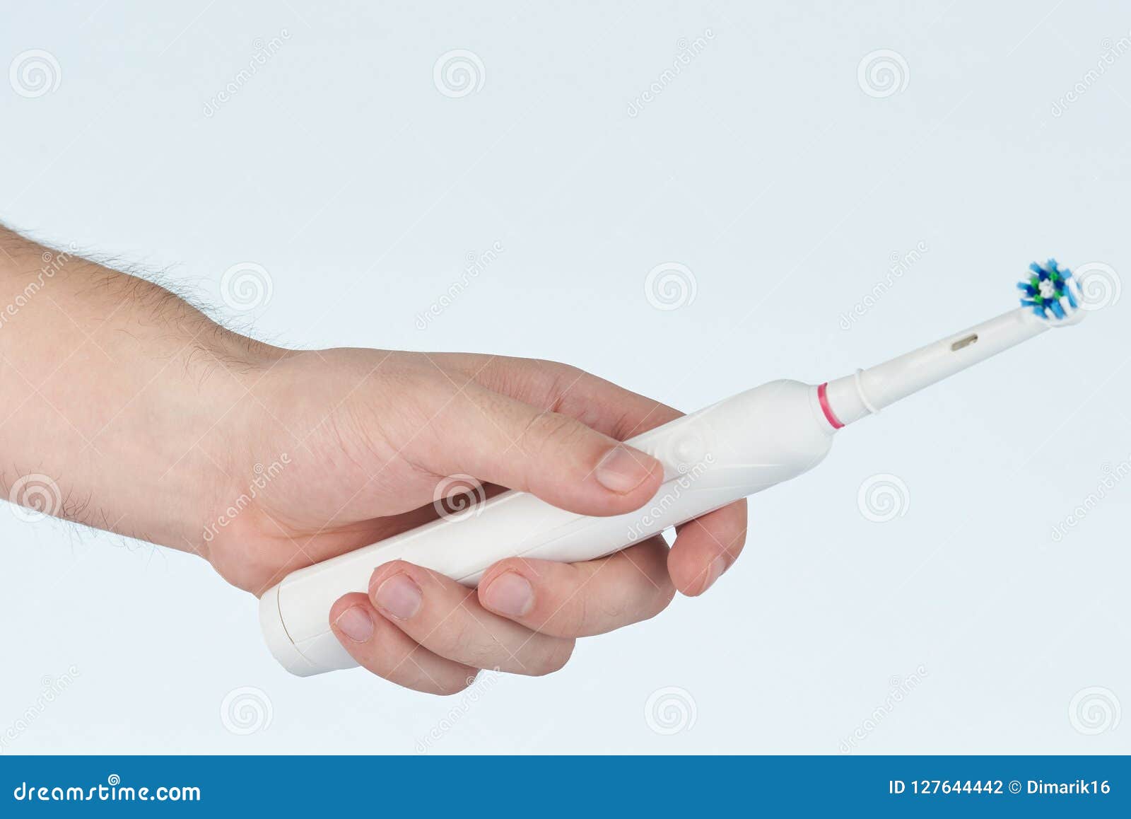 Hand Hold Electric Toothbrush Stock Photo - Image of medical, isolated ...